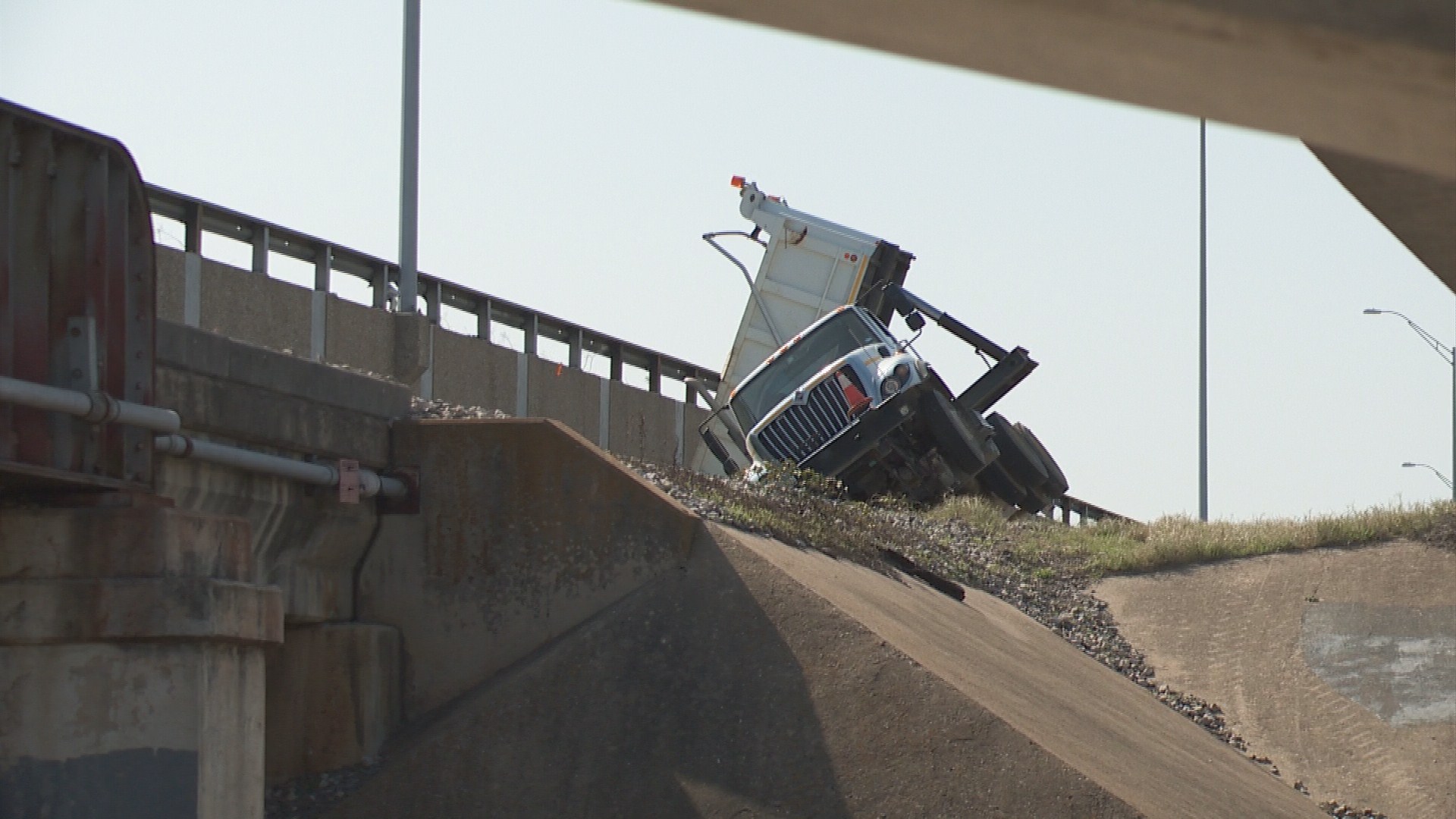 Dump truck crashes, lands on its side on MoPac | kvue.com